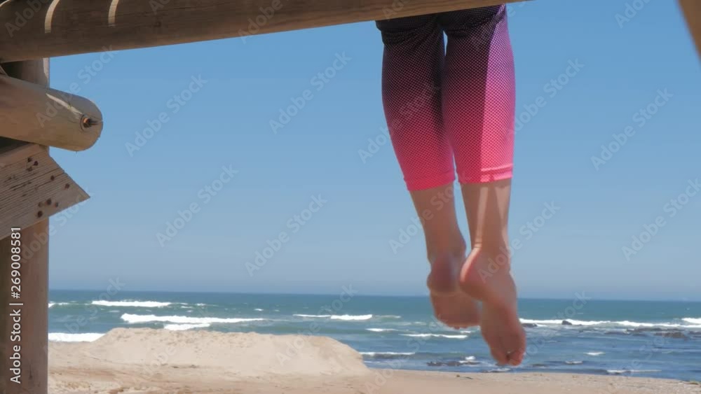 Swinging bare feet of woman sitting and relaxing on seach Stock Video ...