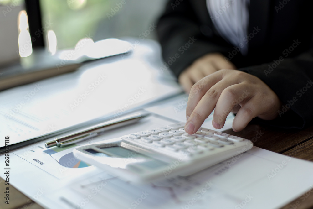 The company's female accountant is checking the company's financial ...