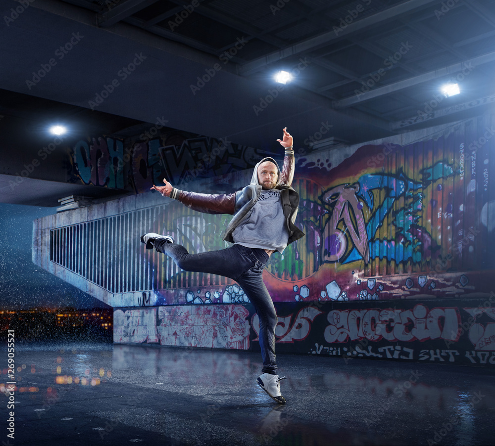 Male Hip Hop Dancer. Beautiful man dancing at night on the background ...
