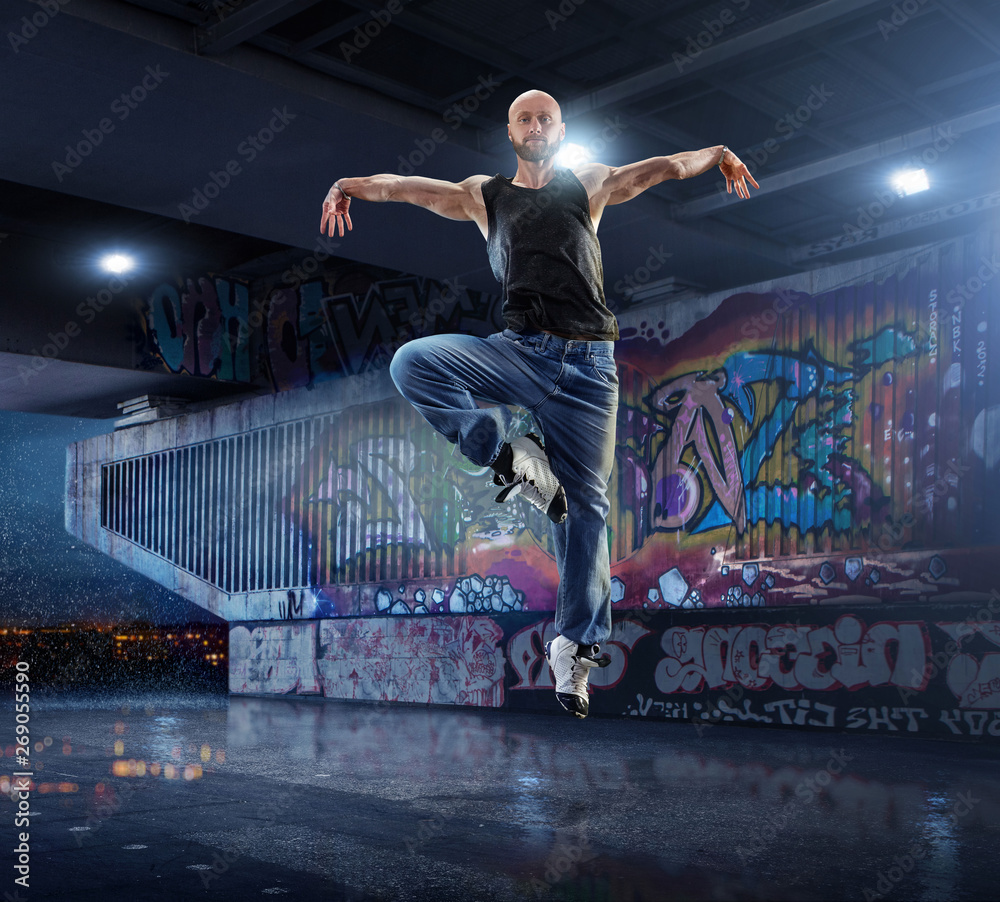 Male Hip Hop Dancer. Beautiful man dancing at night on the background ...