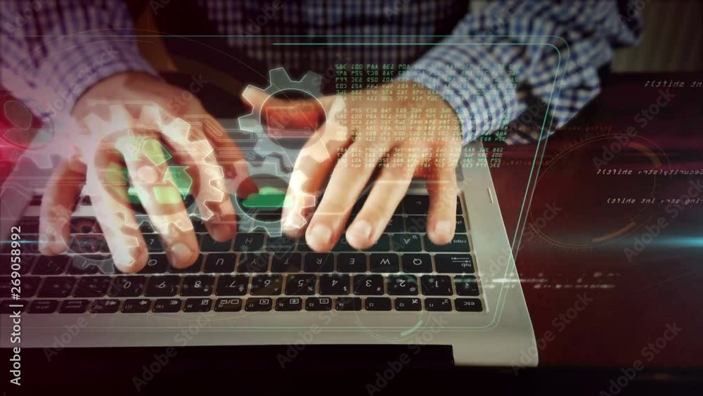 Man typing on laptop keyboard with data managment hologram on screen. Front view of writing ...