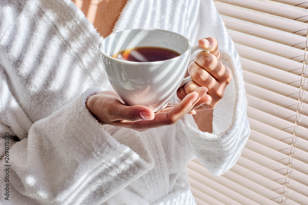 Hands holding cup of tea Stock Photo | Adobe Stock