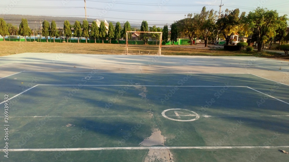 The old football field is basically a cement ... empty without people ...