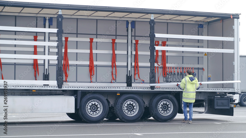 Person open the truck side panel Stock Photo | Adobe Stock