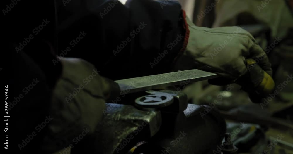 Sword Maker Toledo Spain Blacksmith at work slow motion filing sword ...