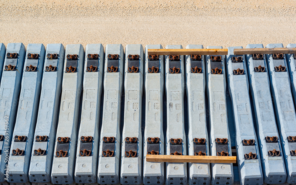 Pile of precast concrete sleepers ready for construction in trackwork ...