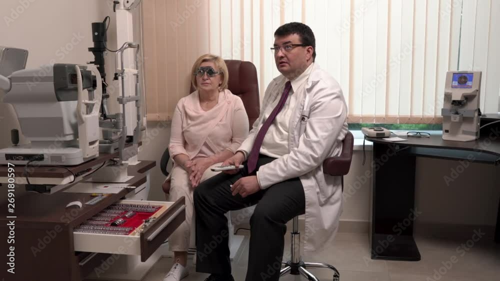 A demonstration video of a professional optician examining patient ...