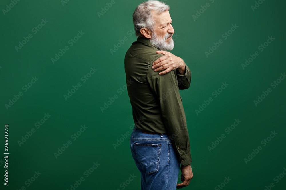 old man massaging his shoulder to reduce pain. close up side view photo ...