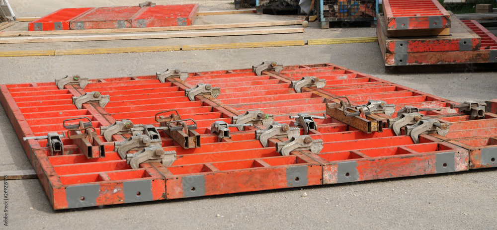 red painted metal formwork elements at construction site Stock Photo ...