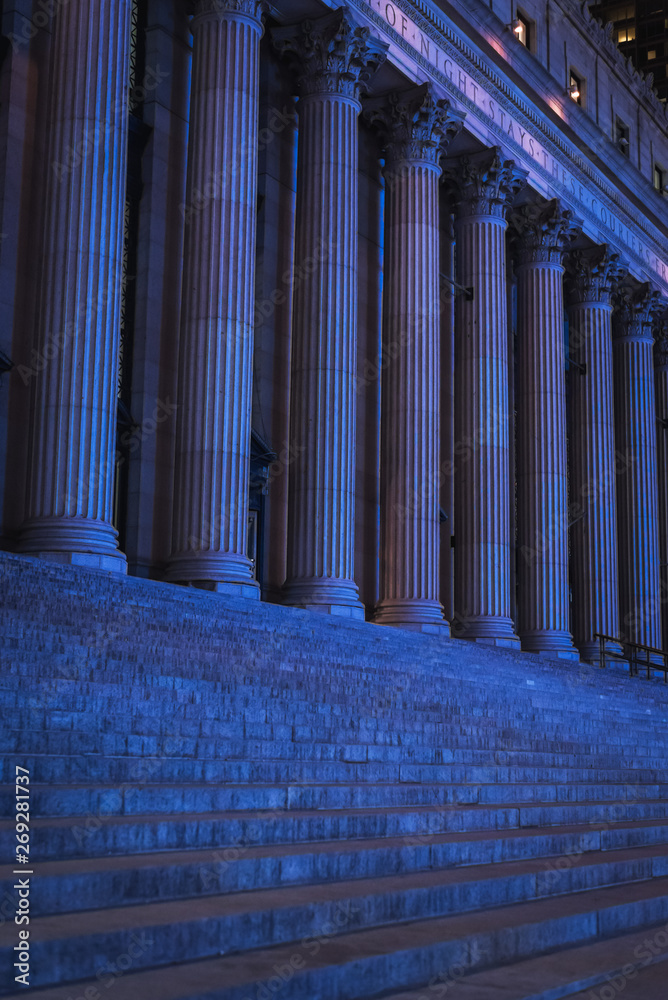 Monumental facade of Penn Station with its towering columns in downtown ...