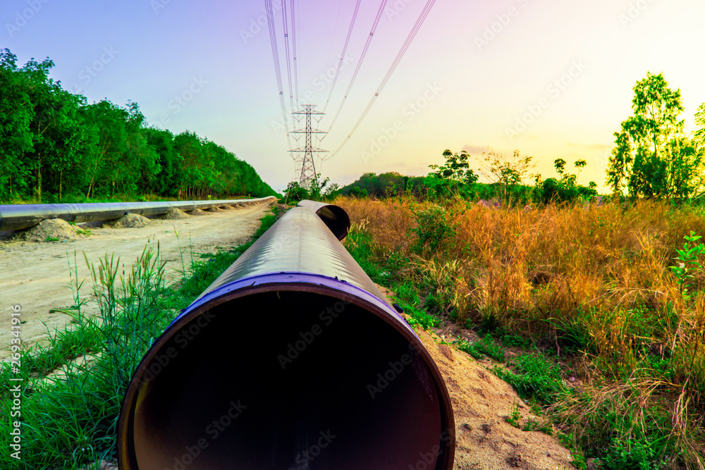 Natural gas pipe line on silhouette sunset sky, Electricity pylon with ...