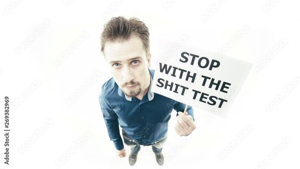 Man holding sign Stop With The Shit Test 4K. Extreme wide shot top view ...