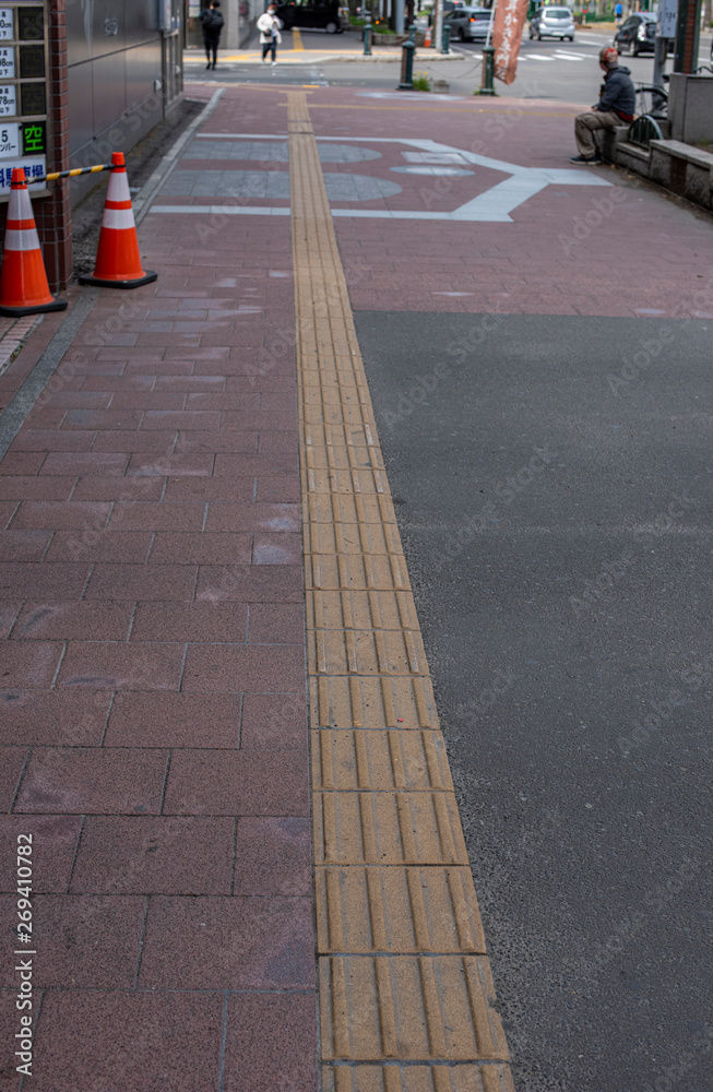 Bright yellow tactile footpath for people who have visually impaired on ...