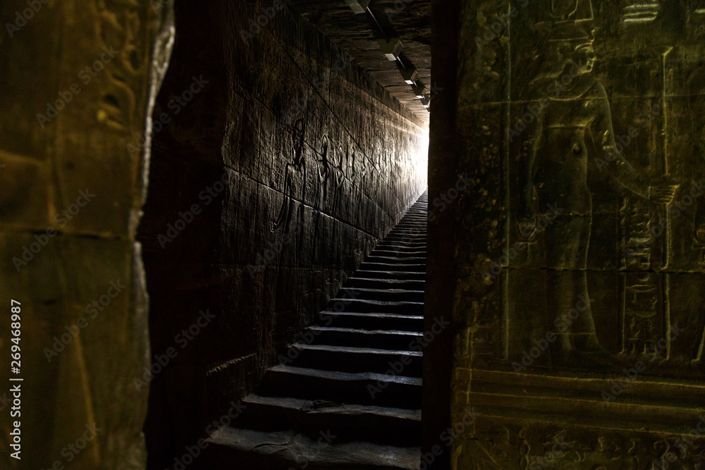 Stairs up and wall with hieroglyphs inside of The Temple of Horus at ...