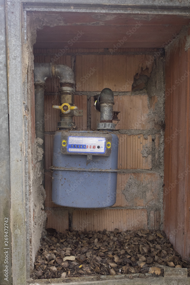 old residential diaphragm gas meter valves and pipes Stock Photo ...