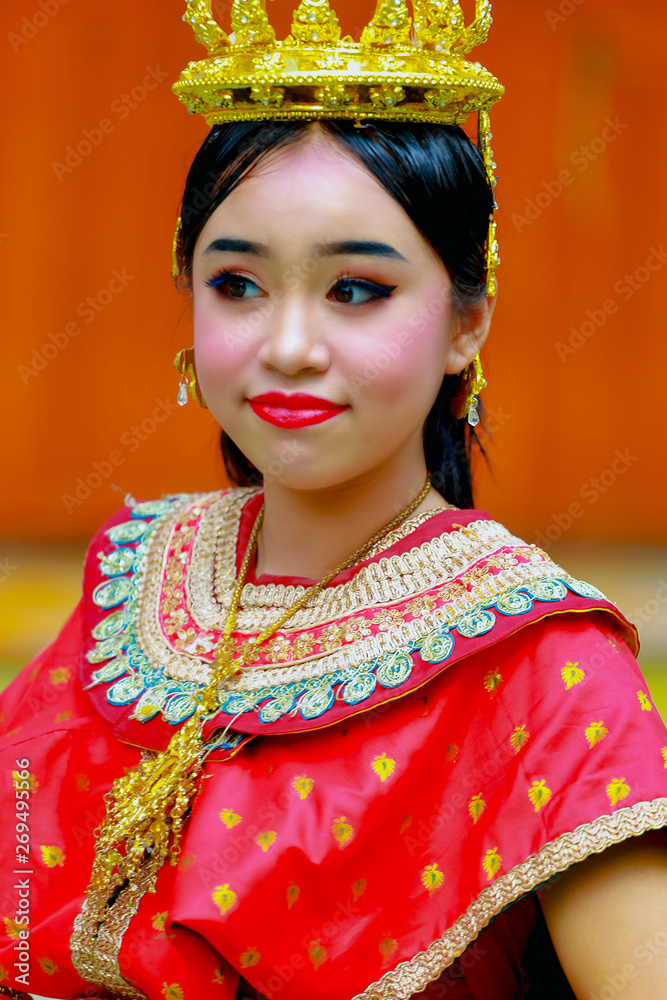 Thai teenage girls in traditional Thai dance costumes Photos | Adobe Stock