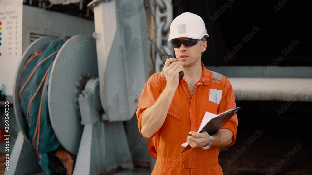Marine chief officer or chief mate on deck of ship or vessel. He fills ...