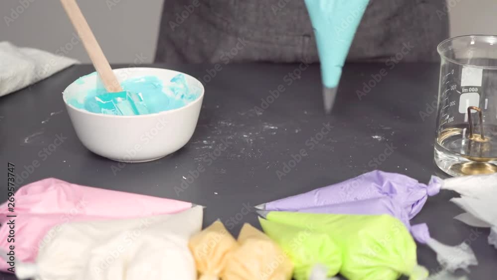 Step by step. Mixing in food coloring into the royal icing to decorate ...