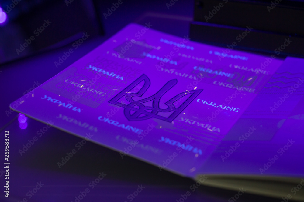 Checking the passport for fraud in UV light, detection of luminescence ...