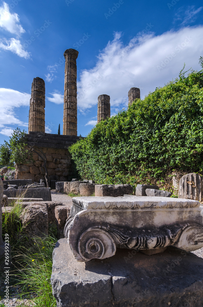 Delphi, Phocis / Greece. Temple of Apollo and a Ionic order capital of ...