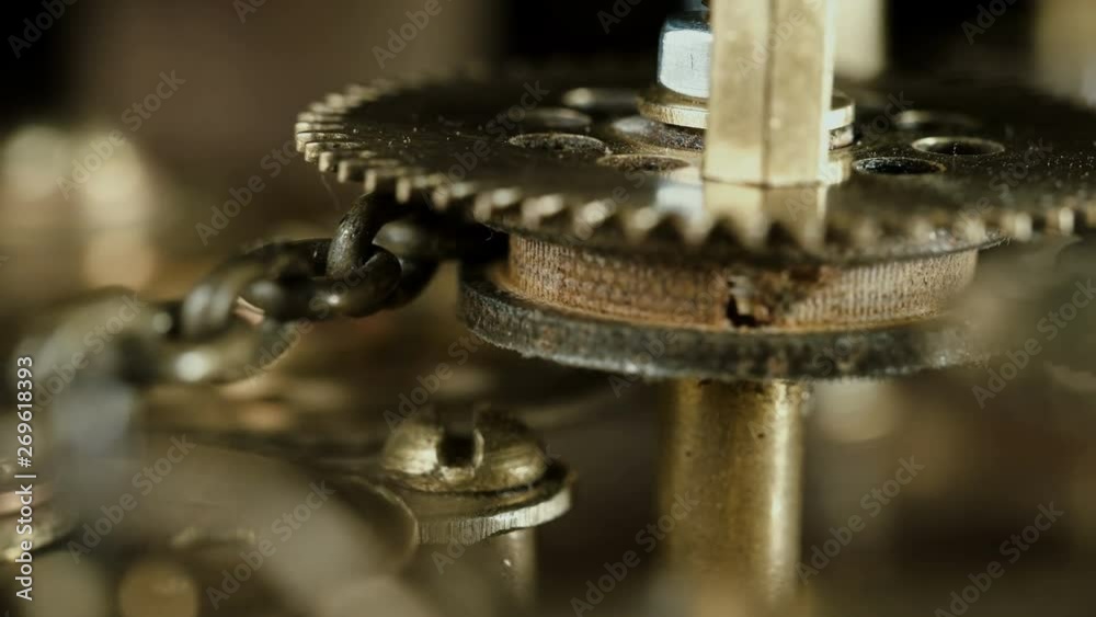 mechanism with rotating gears and a chain, similar to the clock ...