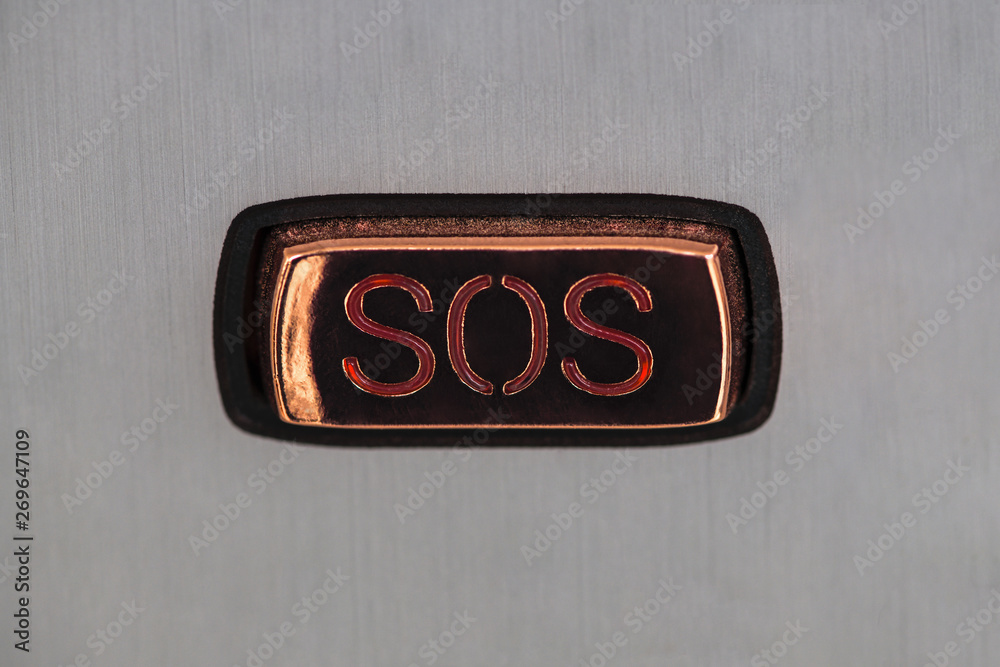 SOS button close-up on the gray metal background of the device ...