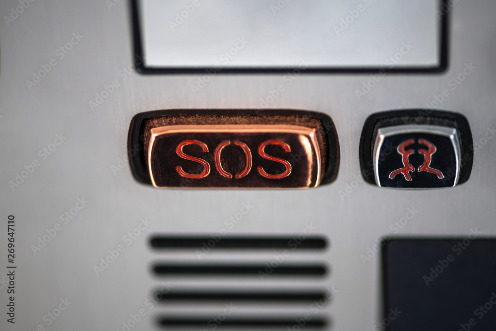 button SOS. SOS button close-up on the device panel, intercom. Help ...