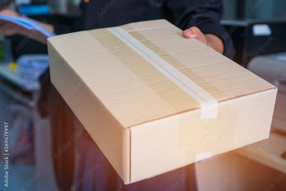 Deliveryman hand holding box cardboard give package to Customer ...