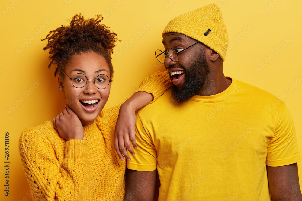 Photo of glad Afro girl leans at shoulder of boyfriend, feel happy ...