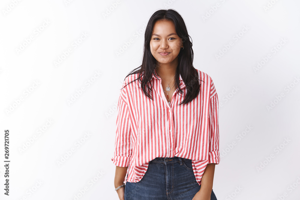 Funny and amused cute girl trying hide laugh as chuckling and smiling ...