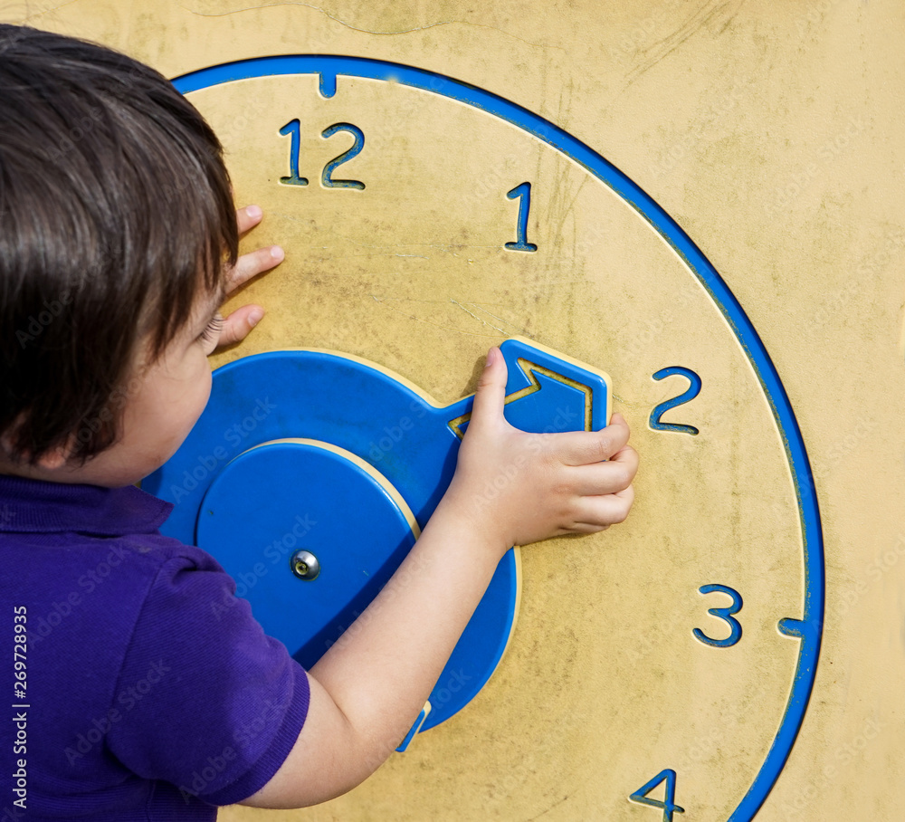 Child learning time with wooden clock at playground in summer, Kid boy ...