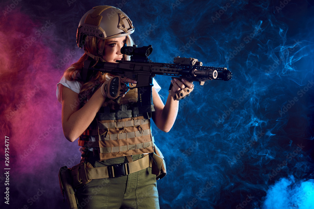 woman sniper in body armour with SVD sniper rifle. Female serving in ...
