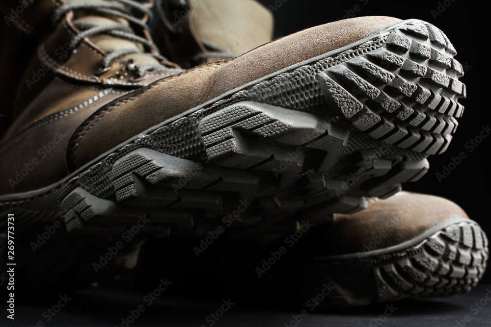 Foto de Closeup photo of military boots and protector. do Stock | Adobe ...