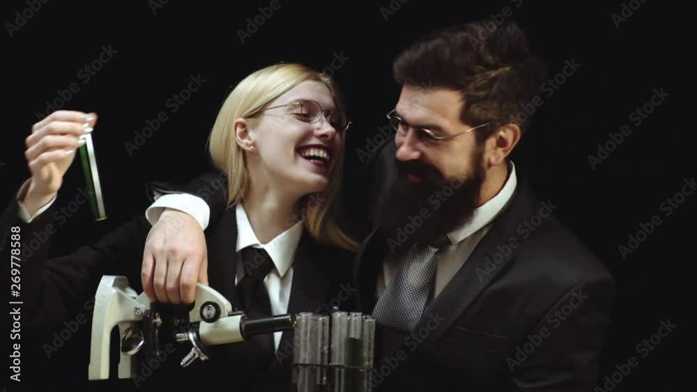 Funny couple and chemistry experiment. School chemistry lessons. Lab ...