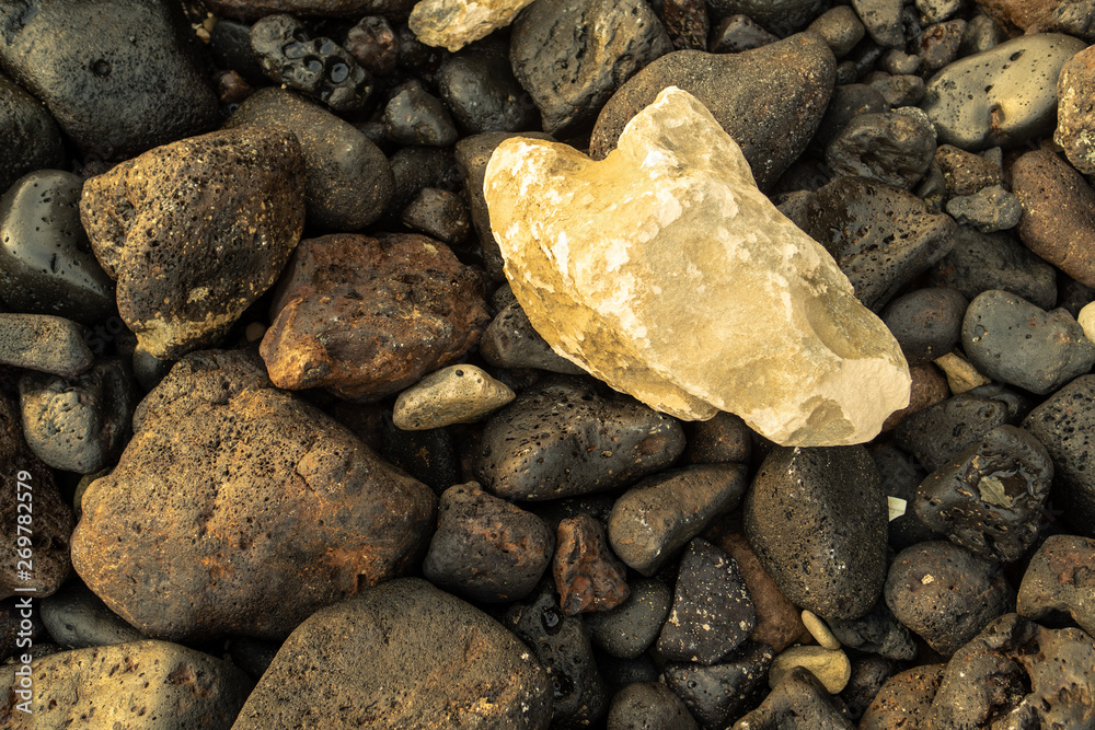 Naturally occurring lava and sedimentary lithified stones mixed ...