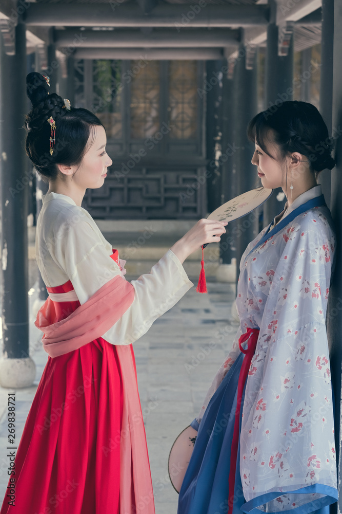Two young women wearing in Chinese Han clothing in traditional Chinese ...