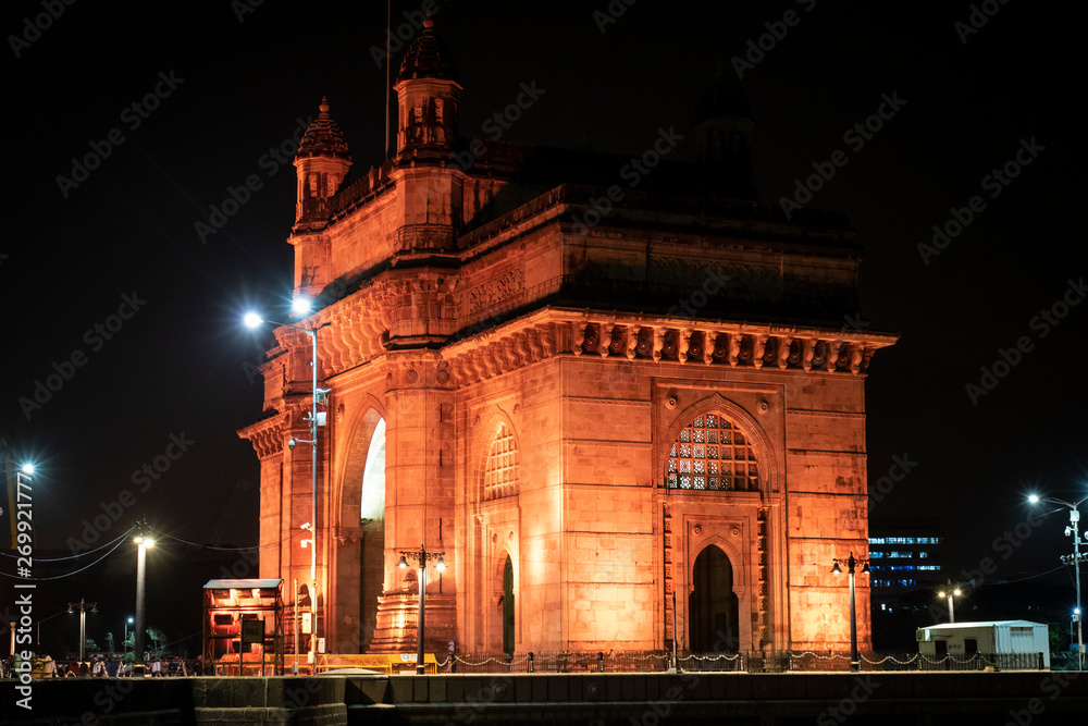 Mumbai's gate of india at night with illuminated lights Stock Photo ...