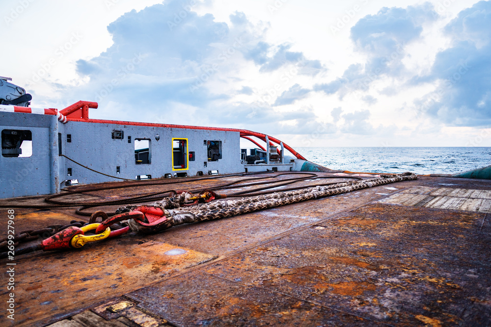 Anchor-handling Tug Supply AHTS vessel crew preparing vessel for static ...