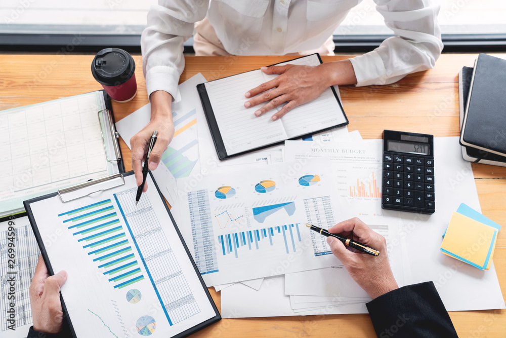 businessmen discussing project at meeting pointing explaining his idea ...