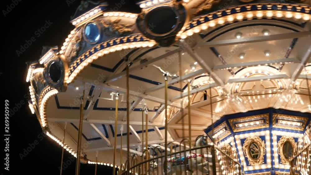 Vídeo do Stock: Illuminated merry go round in park. Brightly ...