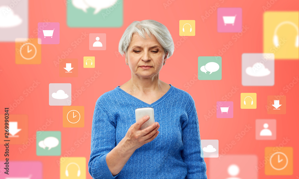 technology, media and old people concept - senior woman using ...