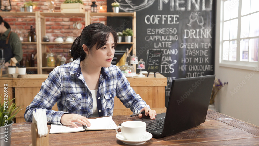 Young korean female freelancer at cafe bar using laptop computer and ...