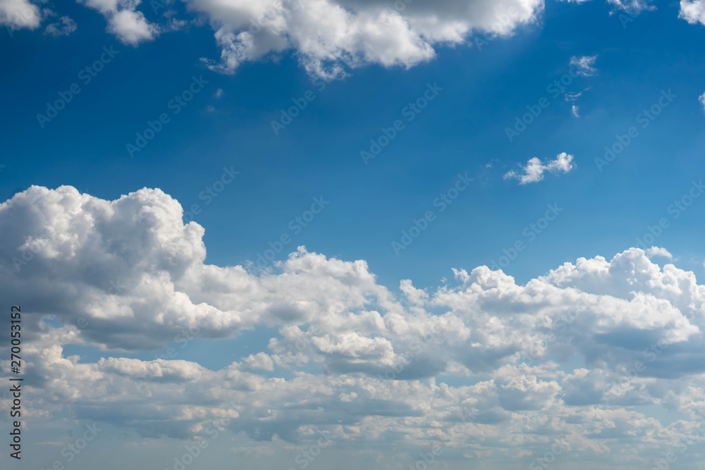 Beautiful blue sky with white clouds and a thin horizon line. Rays The ...