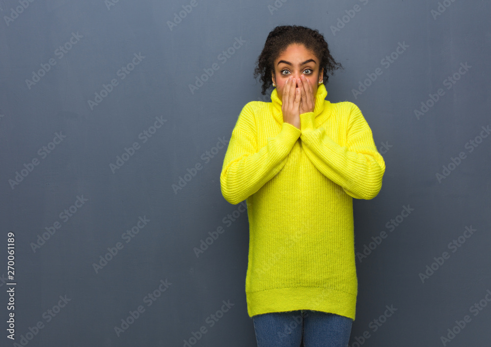 Young black woman very scared and afraid hidden Stock Photo | Adobe Stock