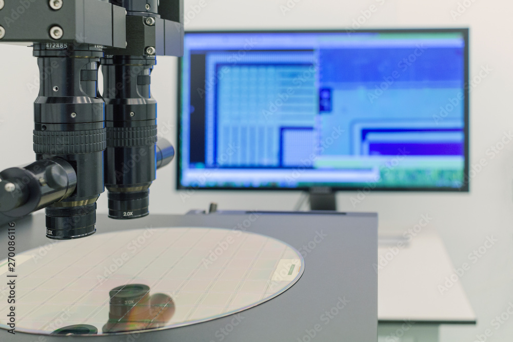Silicon wafer on machine process examining in microscope. Stock Photo ...