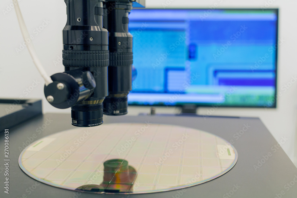 Silicon wafer on machine process examining in microscope. Stock Photo ...