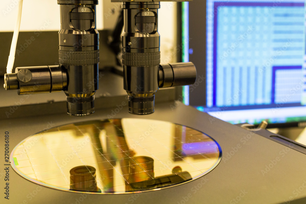 Silicon wafer on machine process examining in microscope. Stock Photo ...