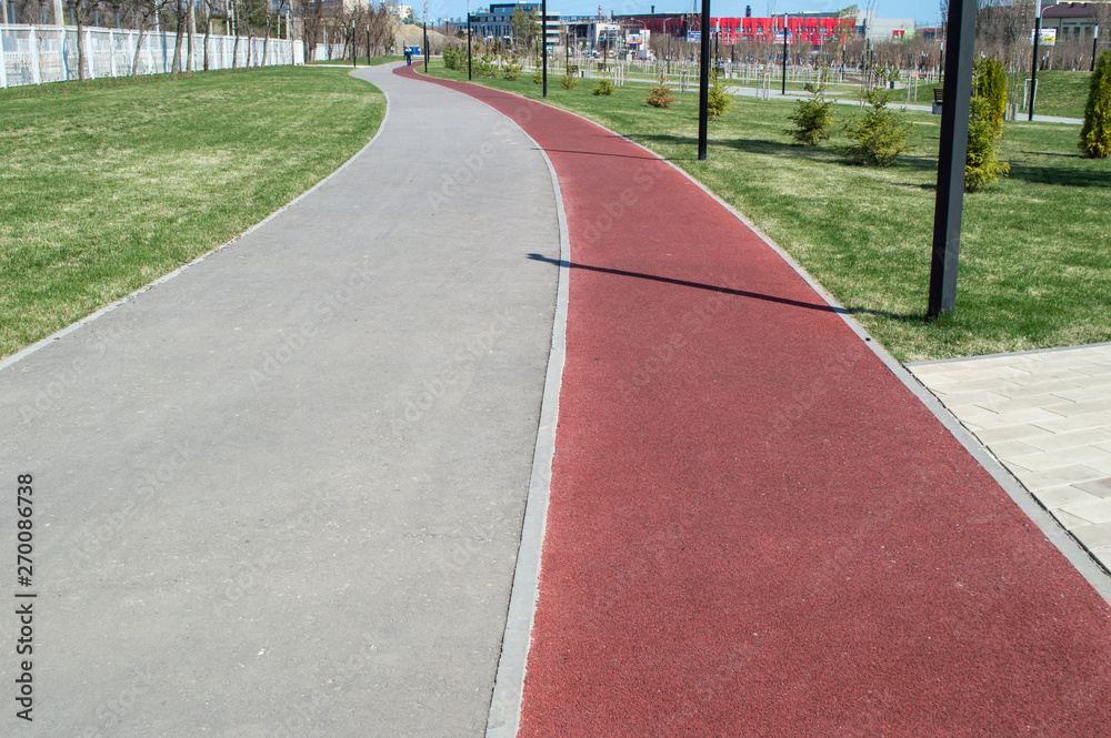 Pathway and beautiful trees track for running or walking and cycling ...