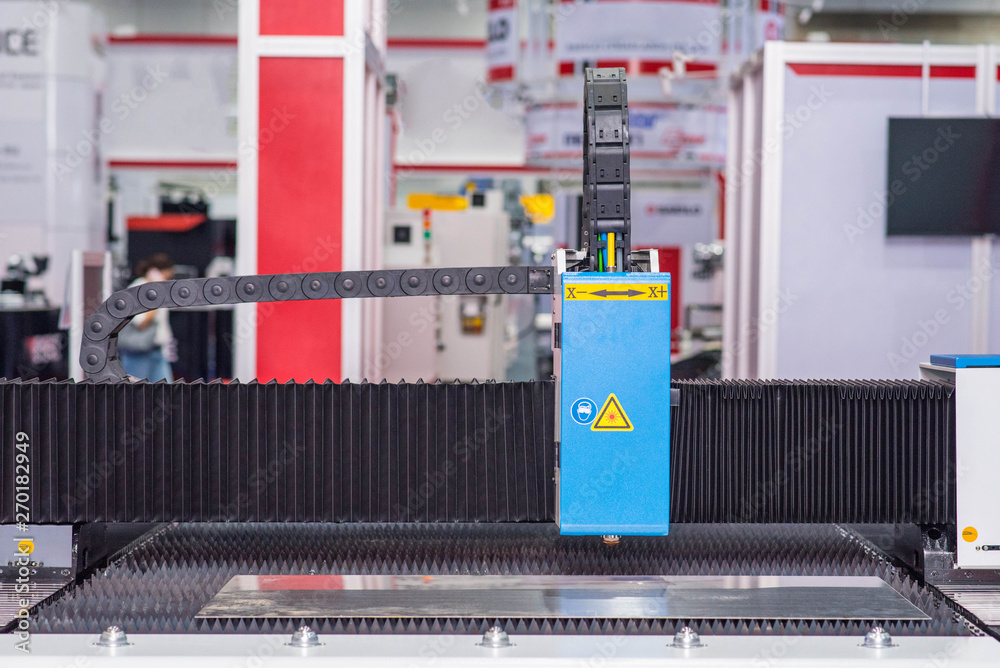 CNC Laser cut machine is working. Stock Photo | Adobe Stock