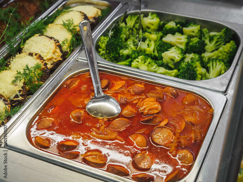 Cuisine cafeteria buffet with food. Self-service food display showcase ...